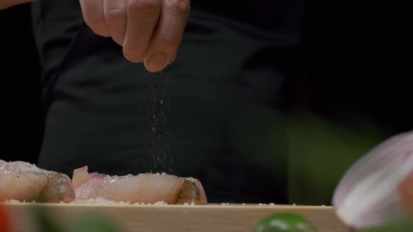 Professional Chef Sprinkles Fish Steak with Pepper, Stock Footage ...