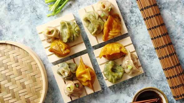 Delicious Mixed Kinds of Chinese Dumplings Served on Wooden Stands ...