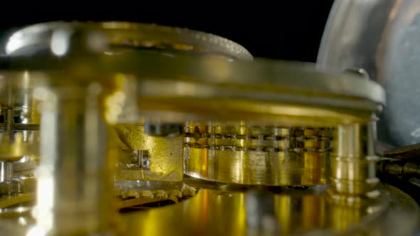 Inside View of a Moving Clockwork of Golden Mechanical Clock on Black ...