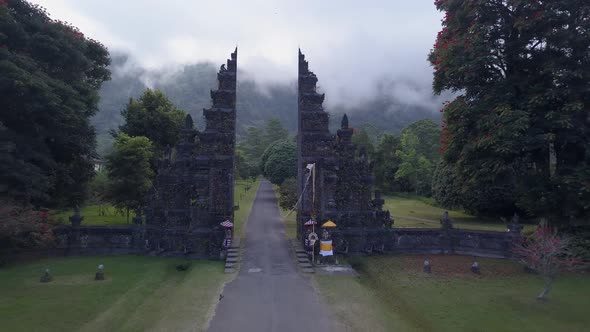 Aerial drone shot going through Handara Gate. Famous spot of Bali. The ...