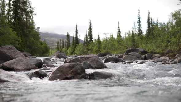 A Stormy Stream of River Carving Its Way Through the Mountain Valley ...