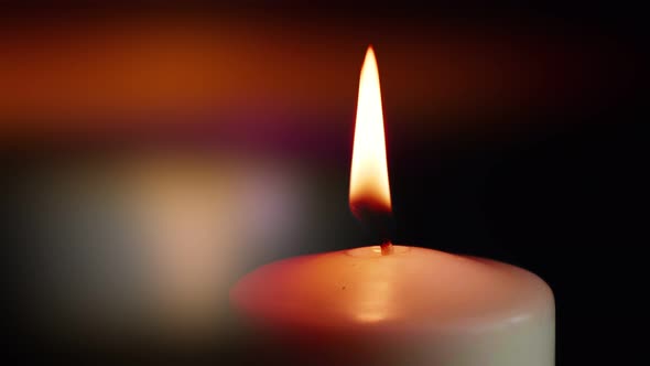 The showcases of colorful single candlelight on black background with ...