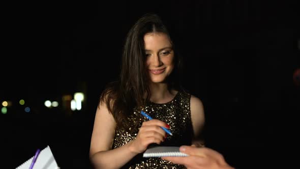 Famous Woman Signing Autographs in Fans Notebooks at Evening Party ...