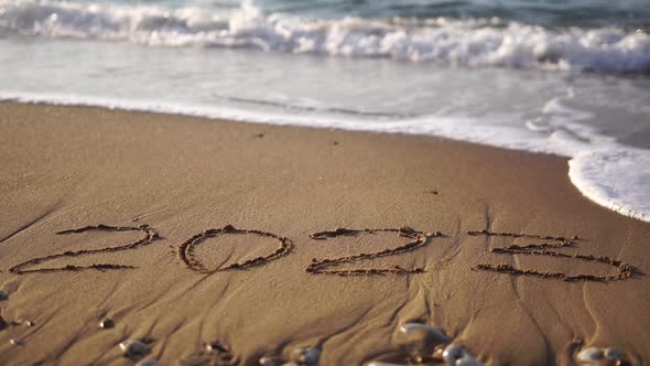 2023 Figures on Sandy Beach Happy New Year 2023 Number Hand Written in ...