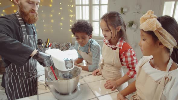 Chef Showing Kids How to Use Stand Mixer on Cooking Masterclass, Stock ...