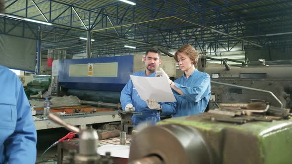 Professional workers teams work in the metalwork manufacturing factory ...