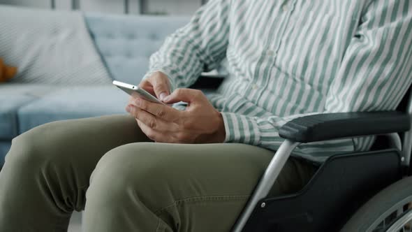 Slow Motion of Handicapped Man in Wheelchair Using Smartphone Touching ...