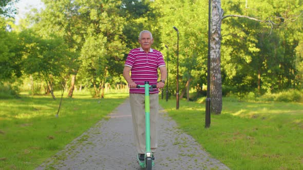 Senior Stylish Man Grandfather Riding Electric Scooter in Park Modern ...