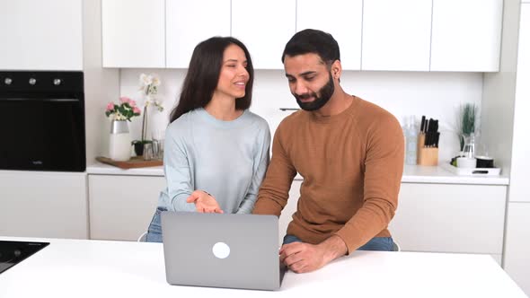 Smiling Indian Couple in Love Sitting at the Countertop in Modern ...