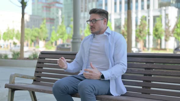 Tense Man Feeling Frustrated While Sitting Outdoor on Bench, Stock Footage