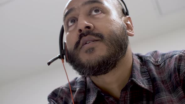 A call centre agent facilitates the calling process for a customer ...