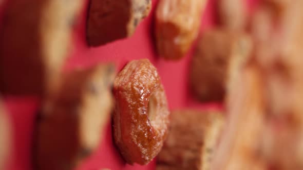 Vertical video, A pattern of different cookies laid out on a red ...