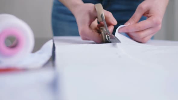 Closeup of Woman's Hand Cutting Tissue with Scissors, Stock Footage