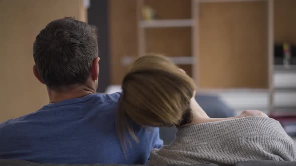 Back View Woman Putting Head on Shoulder of Man Pushing Away Spouse ...