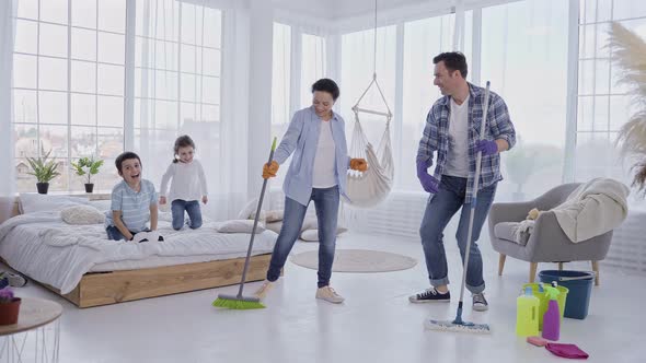 Joyful Couple Having Fun During House Cleaning, Stock Footage | VideoHive