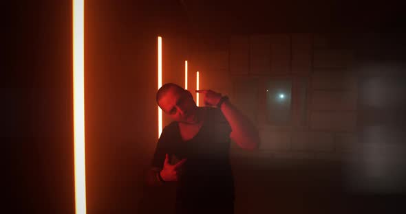 Male Rapper Walking Near Red Lamps, Stock Footage | VideoHive