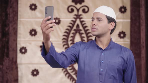 Indian Muslim man talking on video call, Stock Footage | VideoHive