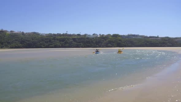 Canoes going by at Nahoon River, South Africa., Stock Footage | VideoHive