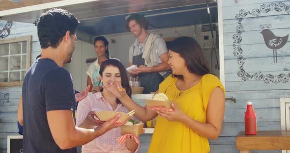 Smiling friends eating snacks, Stock Footage | VideoHive