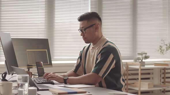 Portrait of Asian Developer at Workplace, Stock Footage | VideoHive