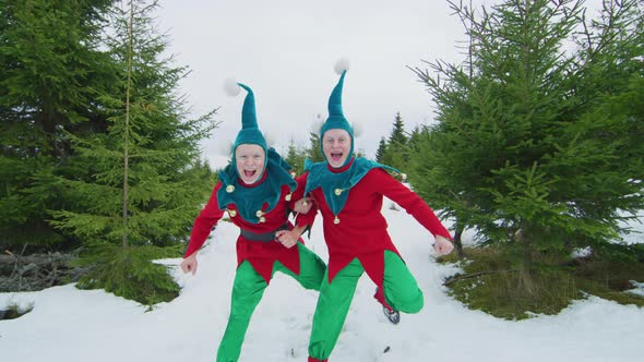 Two happy elves jumping together, Stock Footage | VideoHive