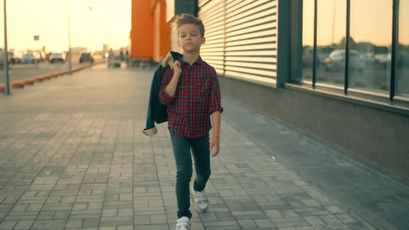Alone Little Boy Is Walking Down the Street and Thinking. Face of a ...