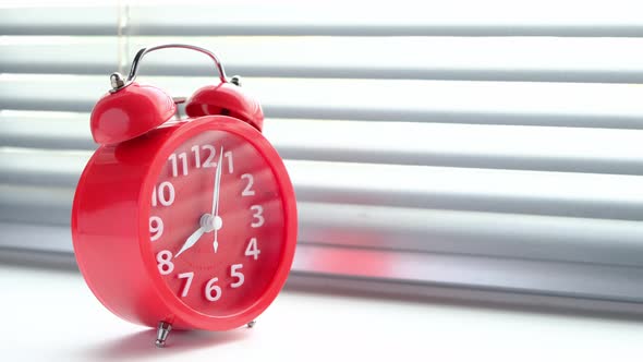 Red alarm clock rang early morning at eight clock morning., Stock Footage