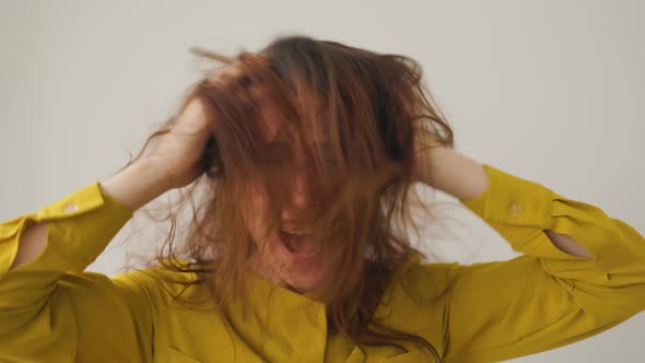 A Woman with Ruffled Hair Grabbed Her Head, Stock Footage | VideoHive