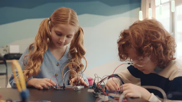 Two Ginger Kids Constructing Robots in School, Stock Footage | VideoHive