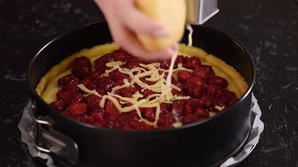 Woman Grating Pastry Dough With A Grater On Cherry Pie. Cooking Process ...