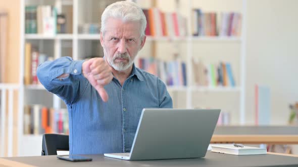 Upset Old Man with Laptop Doing Thumbs Down , Stock Footage | VideoHive