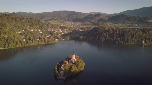 Aerial view of Lake Bled with row boat in background. Located near ...
