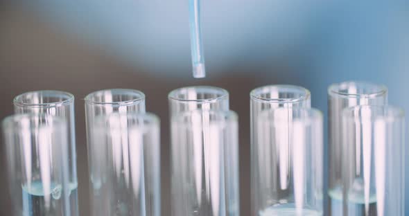 Extreme Close Up of Pipette Dropping Water Into Sample Tube at ...