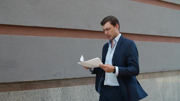 Business Man Walking with Papers. Man Holding Documents at Street ...