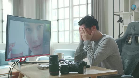 Asian Cameraman Being Tired While Using Desktop Computer For Editing ...