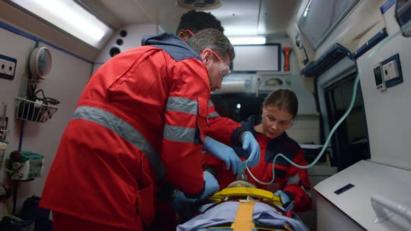 Ambulance Doctors Saving Life of Victim in Ambulance Vehicle, Stock Footage