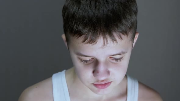 Portrait of a Guilty Talking Child Looking Down at Floor with Downcast ...