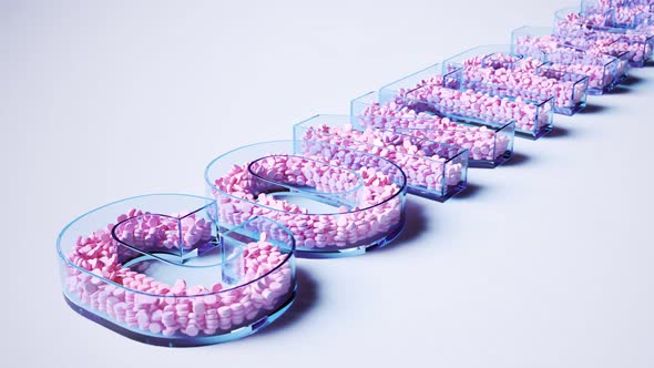 Birth control pills in a glass container in contraception text shape ...