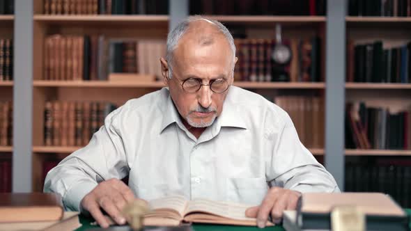 Pensive 70s Elderly Man Scientist Professor Reading Vintage Paper Book ...