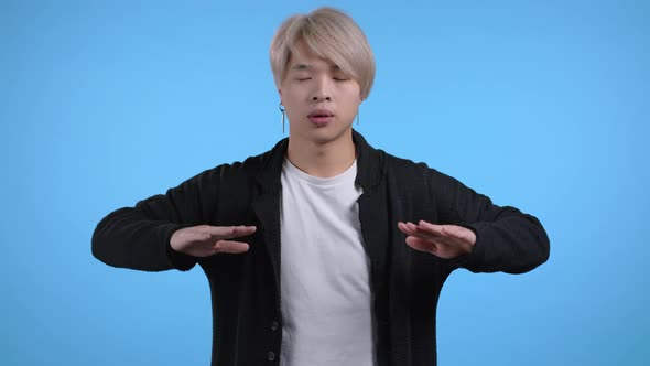 Calm Asian Man Relaxing Meditating, Stock Footage | VideoHive