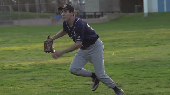 A young man playing catch with a baseball., Stock Footage | VideoHive
