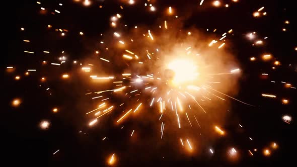 Cracker sparkles spinning isolated on a black background, Stock Footage