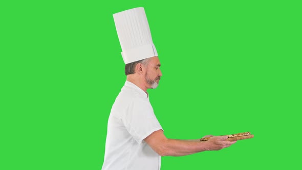 Chef Walking Fast with Pizza on a Green Screen Chroma Key, Stock Footage