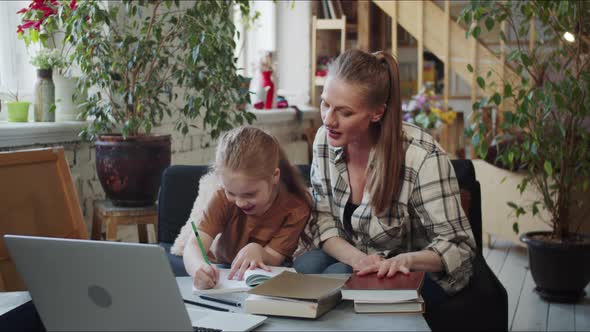 Mom Enters the Room to Check How Her Daughter is Doing Her Homework ...