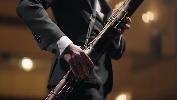 Talented Bassoonist is Playing Music During Concert in Opera House ...