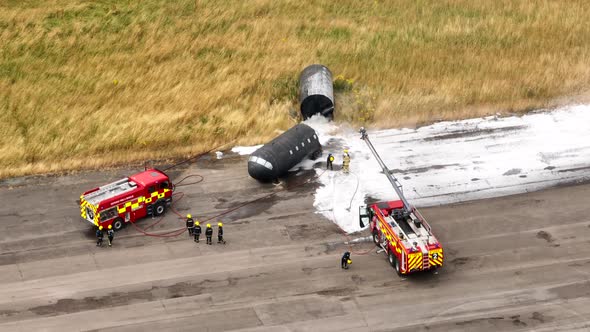 Firefighters Training to Tackle a Fire of a Dummy Aircraft, Stock Footage