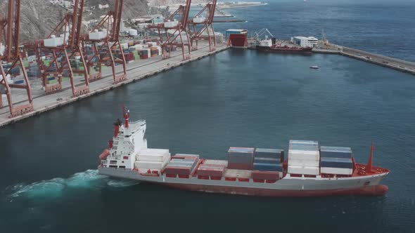 A Containerized Cargo Ship Enters the Port for Unloading, Stock Footage