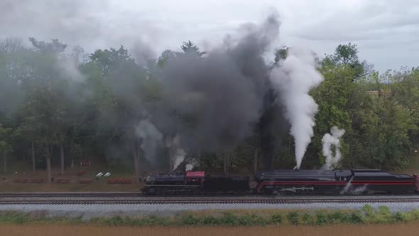 Aerial Side View of a Two Steam Locomotives Double Heading a Freight ...