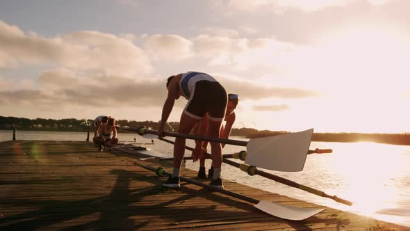 Male rower holding oars on jetty, Stock Footage | VideoHive