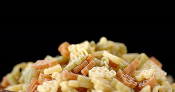 Colored Dry Pasta Rotelle Rotates Slowly. , Stock Footage | VideoHive